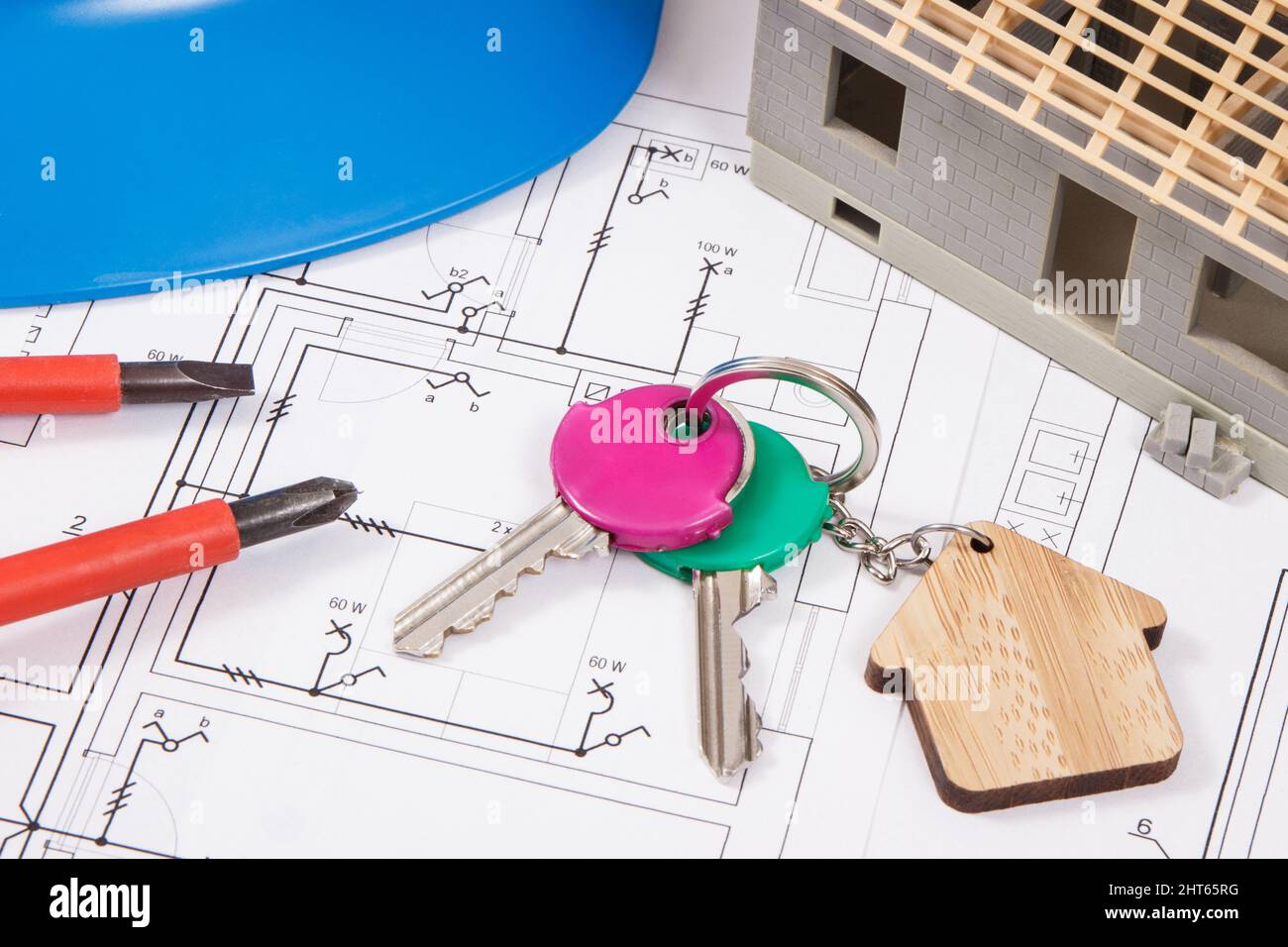 Home keys, electrical construction diagrams or blueprint and small ...