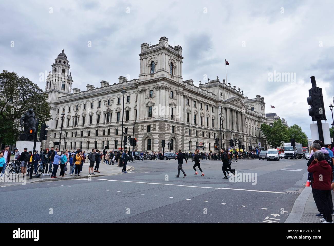 Parliament square and Churchill statues in London, England. Busy street ...