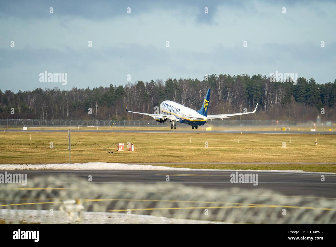 15-01-2022 Riga, Latvia White Passenger plane fly up over take-off ...