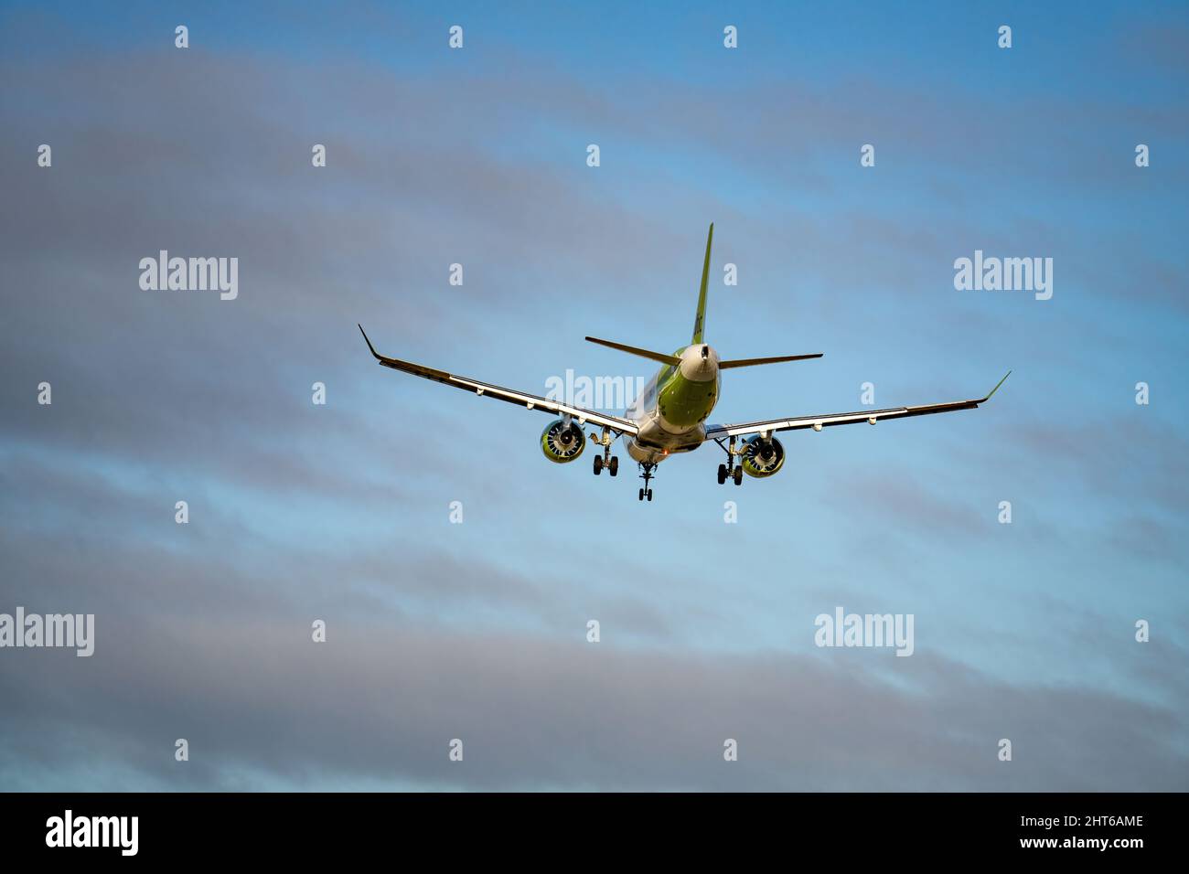 15-01-2022 Riga, Latvia White Passenger plane fly up over take-off runway from airport Stock ...