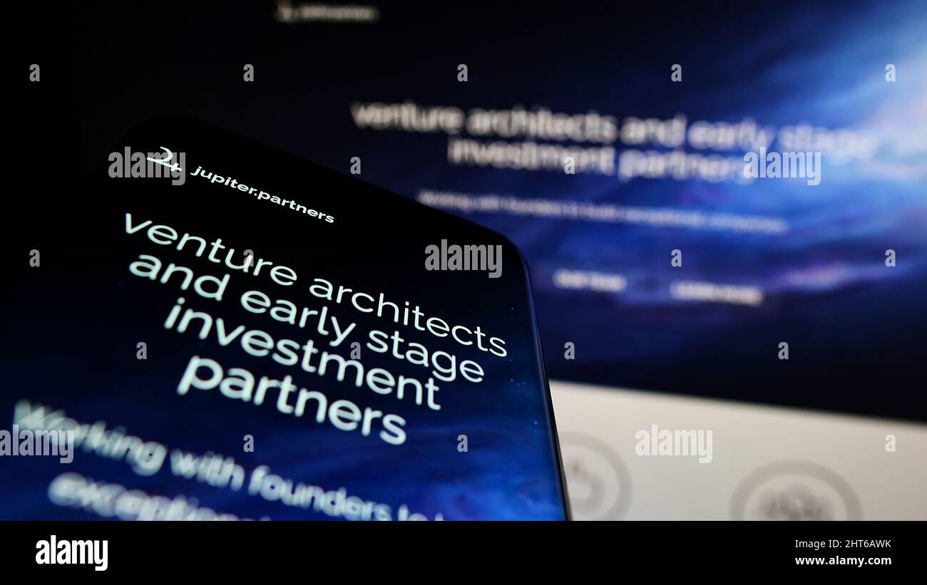 Mobile phone with website and logo of US investment company Jupiter ...