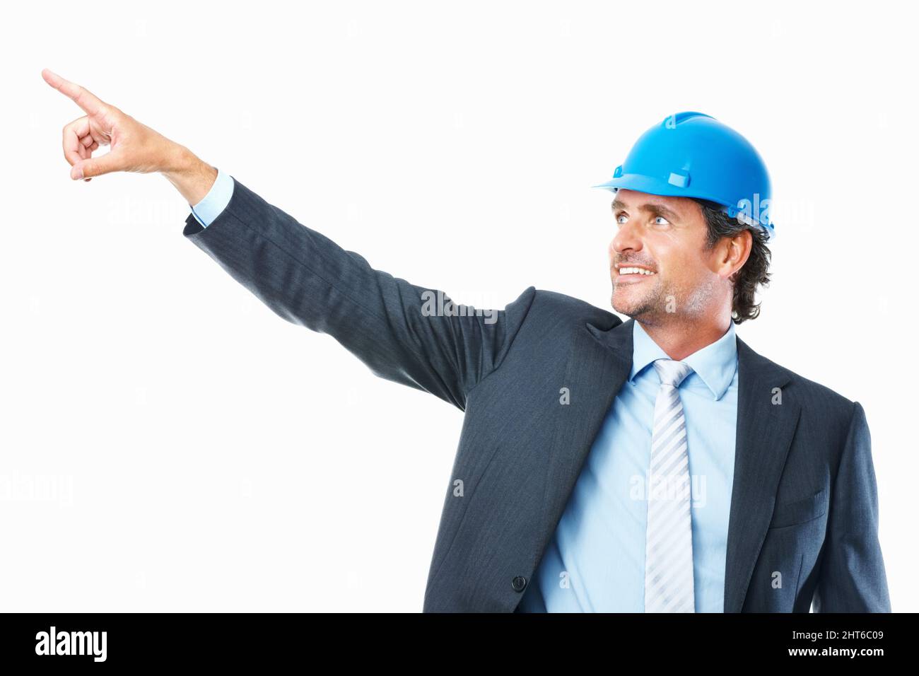 Architect pointing at something. Handsome architect pointing at ...