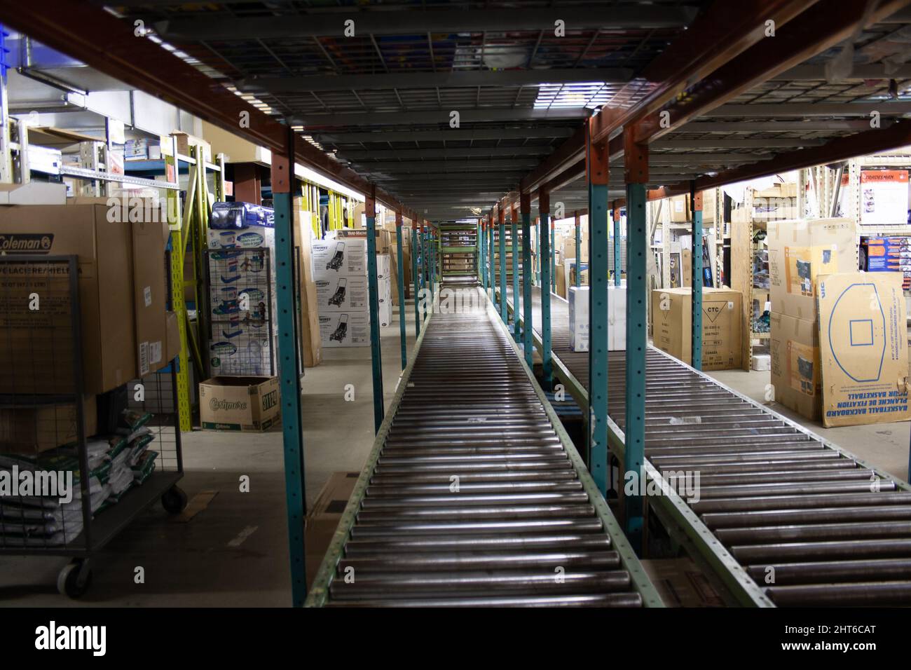 Photo of boxes and stack racks in a warehouse Stock Photo - Alamy