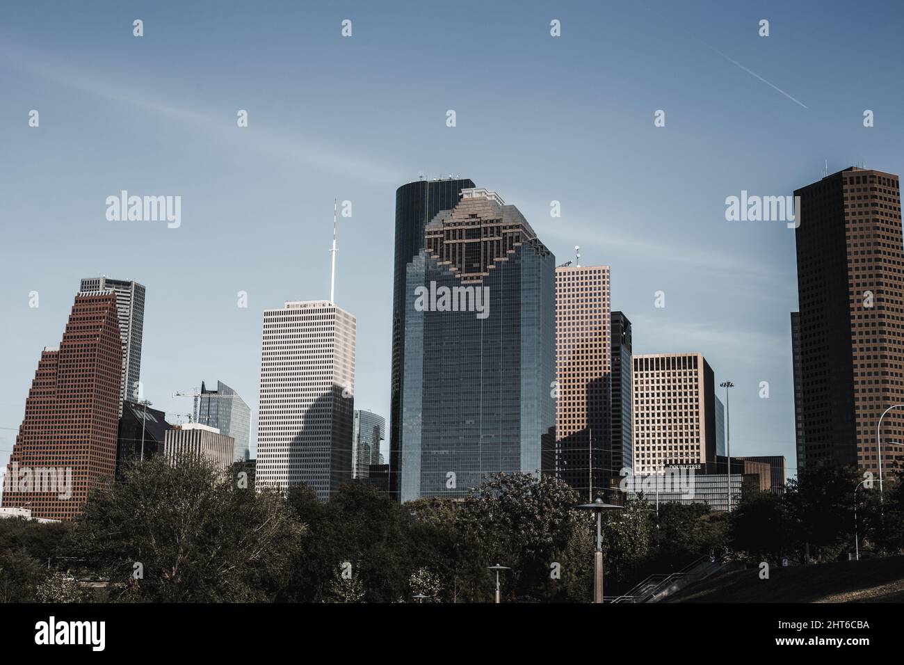 A mesmerizing view of modern buildings against a blue sky in Houston ...