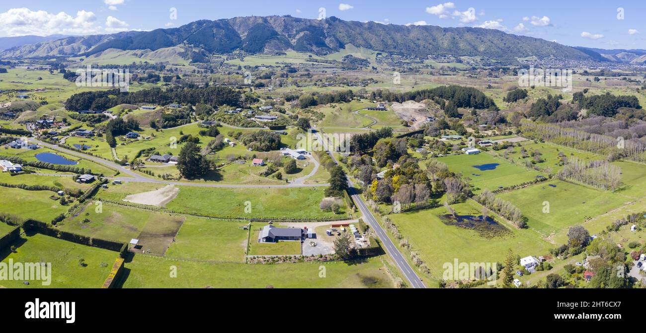 Aerial shot of Peka Peka in New zealand showing wetlands with Tararua ...