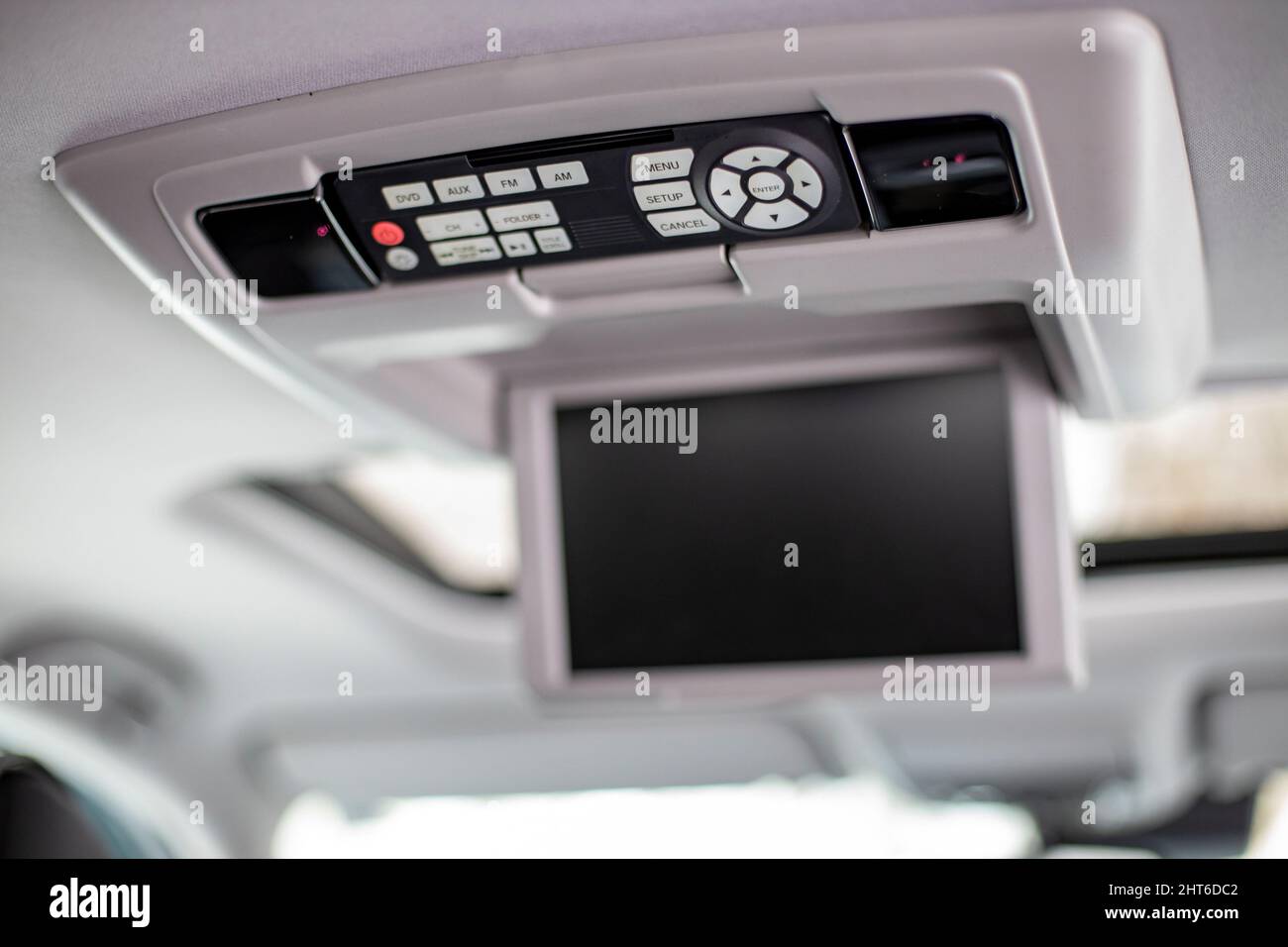 screen m multimedia system control panel on the ceiling of a modern car ...