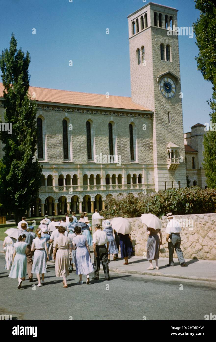 People walking towards Winthrop Hall Clock Tower building, University ...