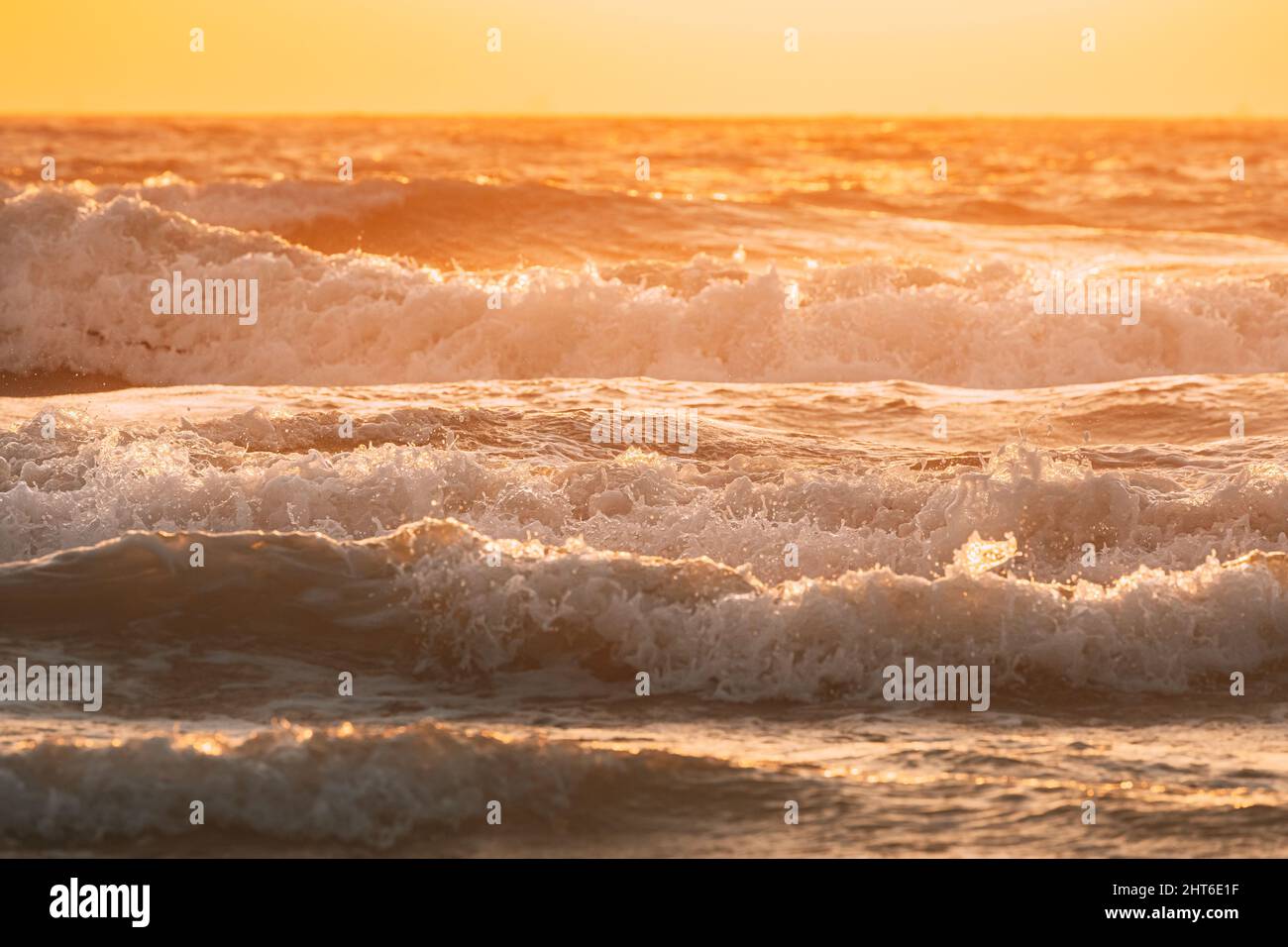 Sea water surface at sunset. Natural sunrise warm colors of ocean. Sea ...