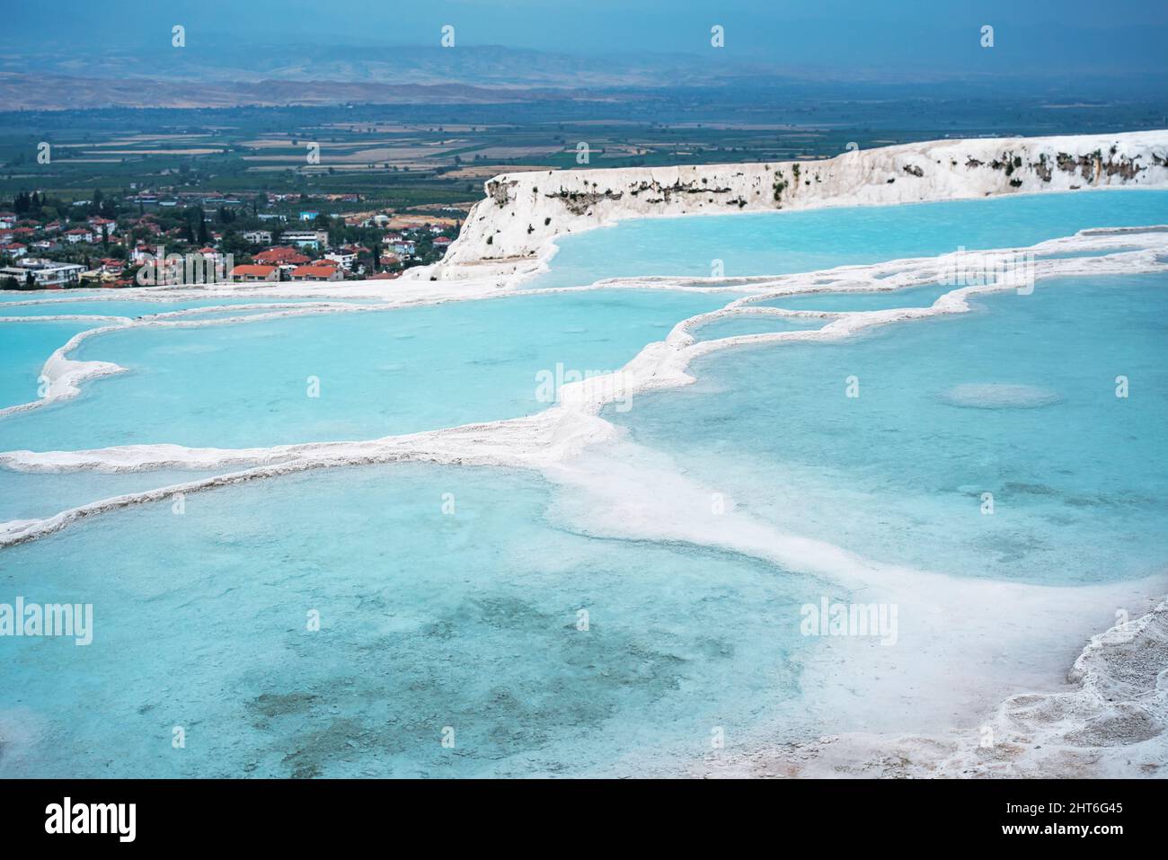 Natural travertine pools and terraces in Pamukkale. Cotton castle in ...