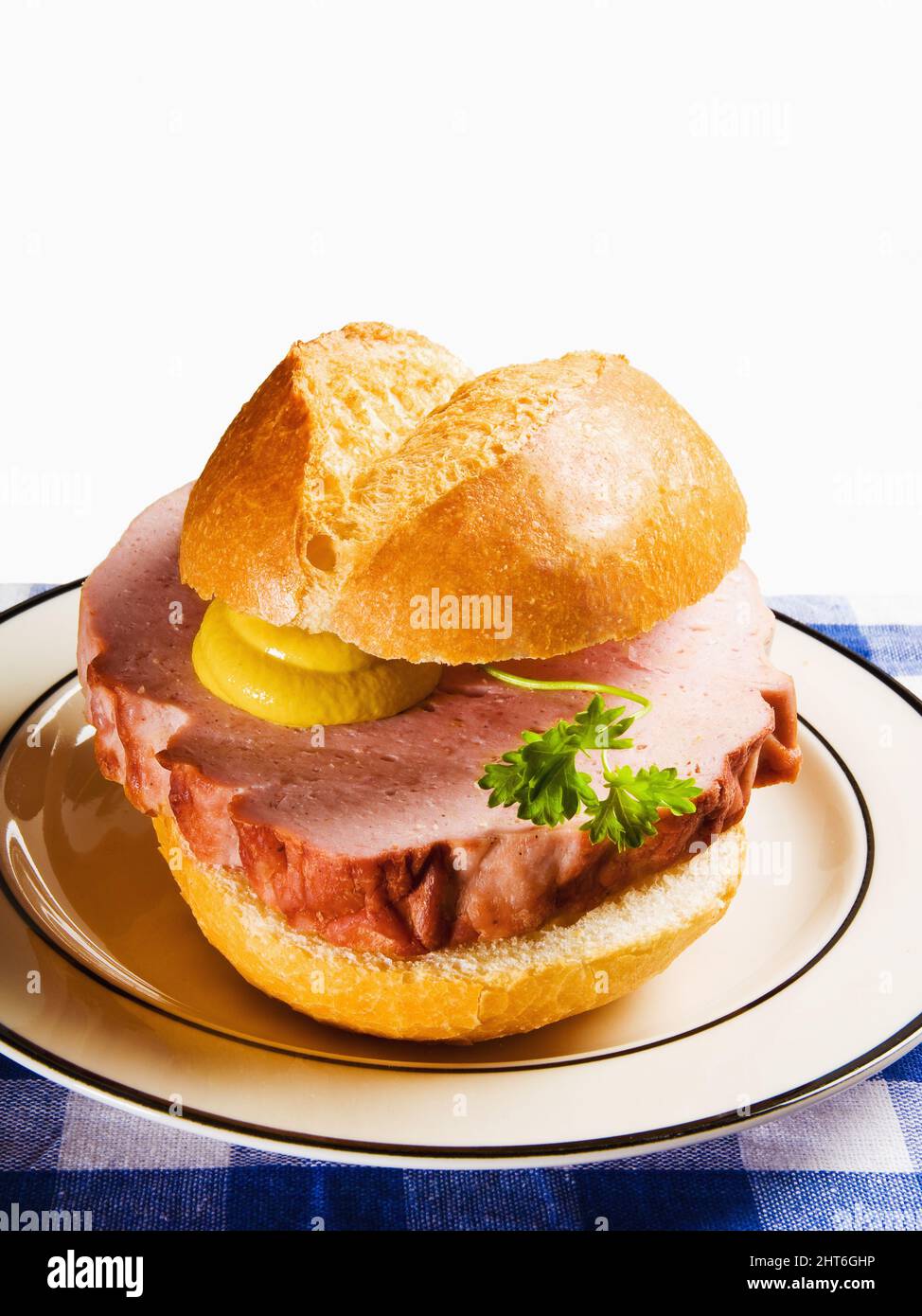 Close-up shot of Leberkase in a white plate on a white background Stock ...