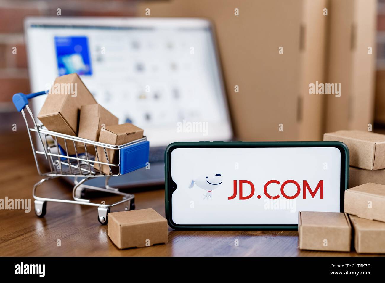 JD.com is a Chinese e-commerce company. Smartphone with JD.com logo on ...