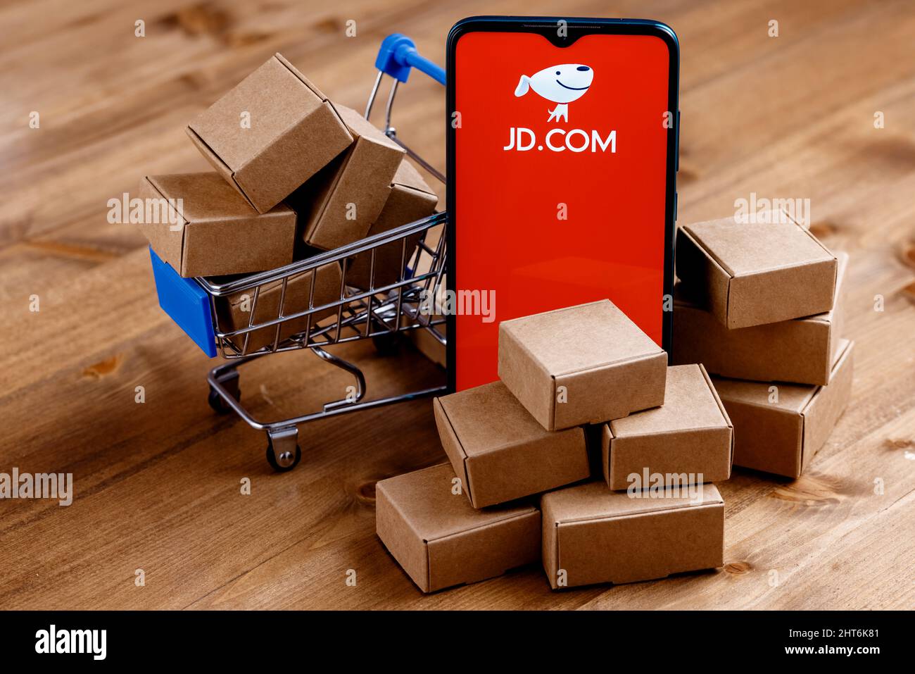 JD.com is a Chinese e-commerce company. Smartphone with JD.com logo on ...