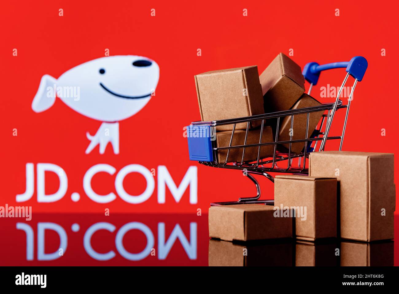JD.com is a Chinese e-commerce company. Shopping cart with parcels on ...