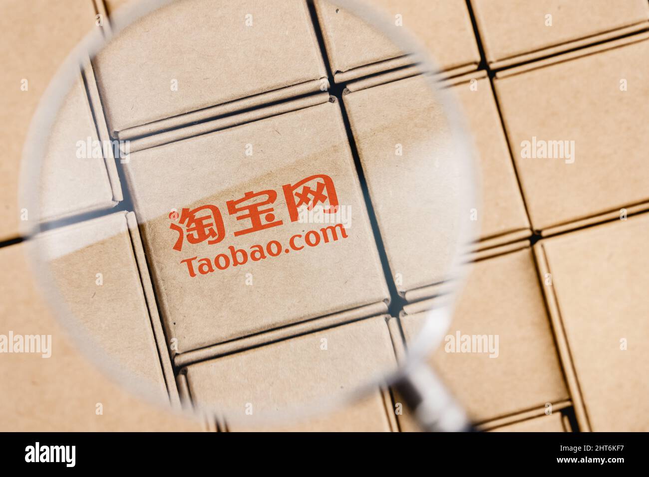 Taobao is a Chinese online shopping platform. Modified photo of Taobao logo on a box under a ...