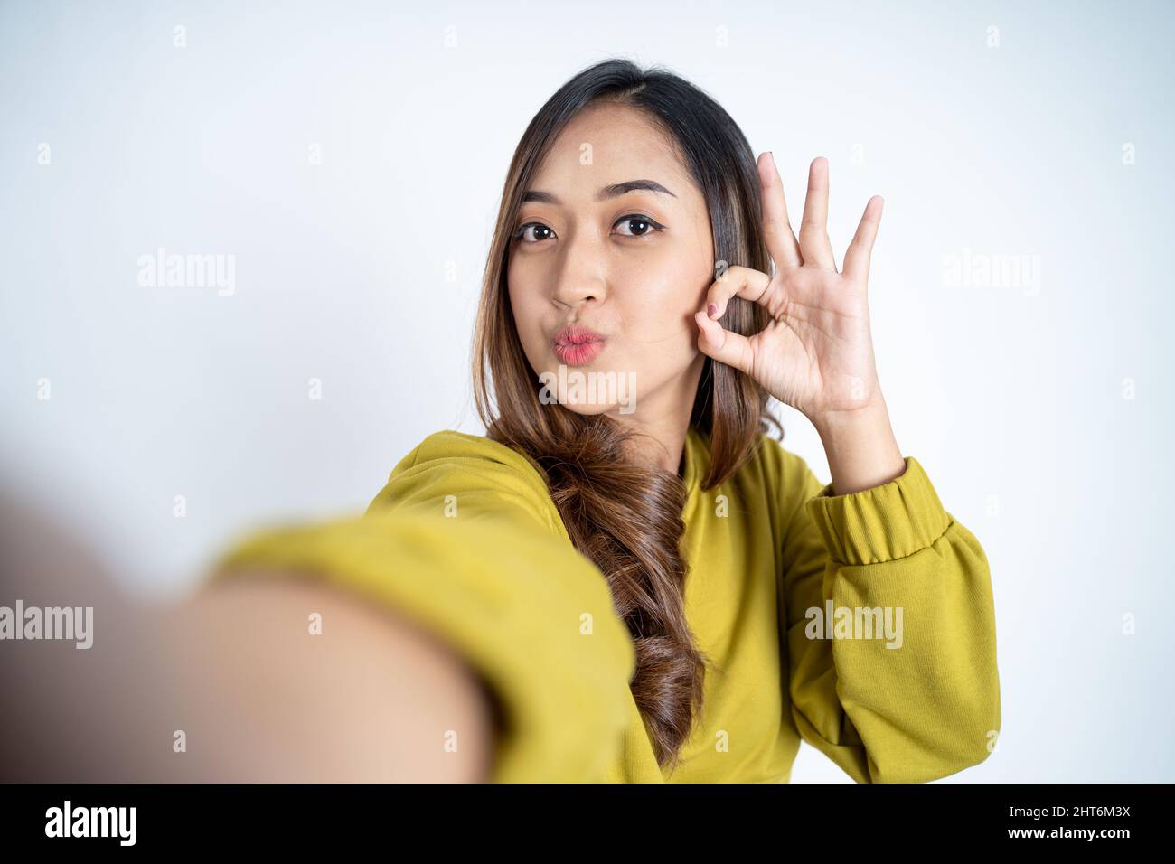 young woman take a selfie with ok hands gesture Stock Photo - Alamy