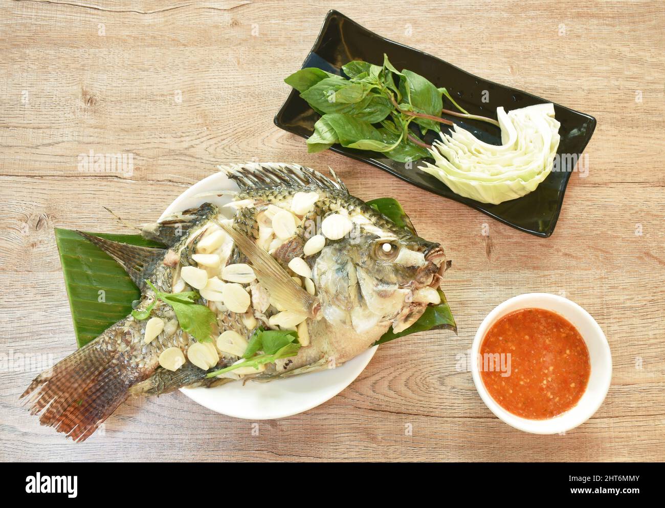 steamed mango fish with vegetable dipping spicy sauce on plate Stock ...