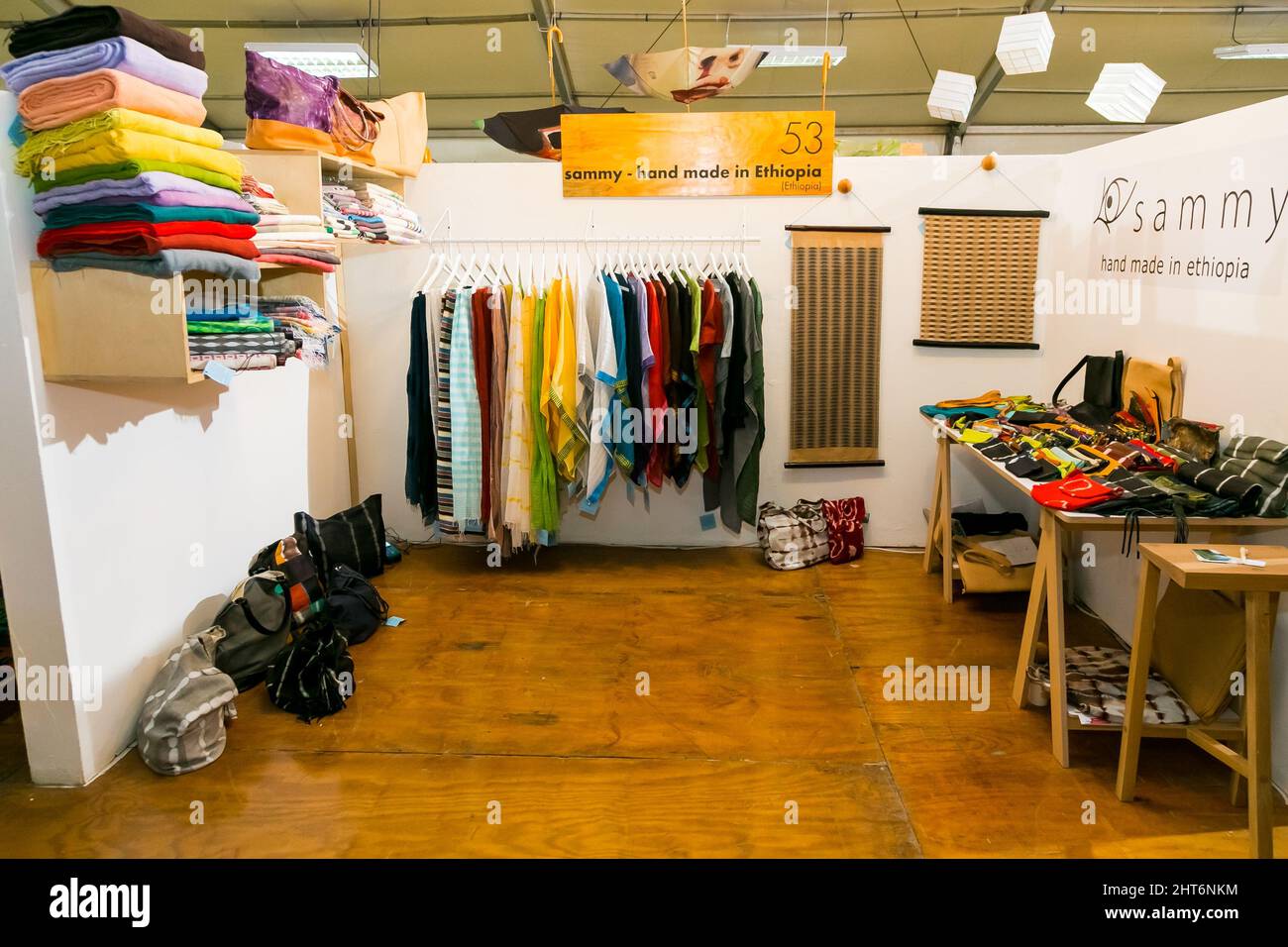 Clothes on display at exhibitor stand at hand-made design fair in ...