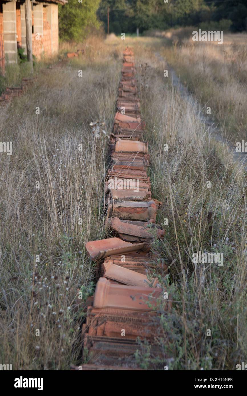 Stone stacked columns with cedar fence Stock Photo - Alamy