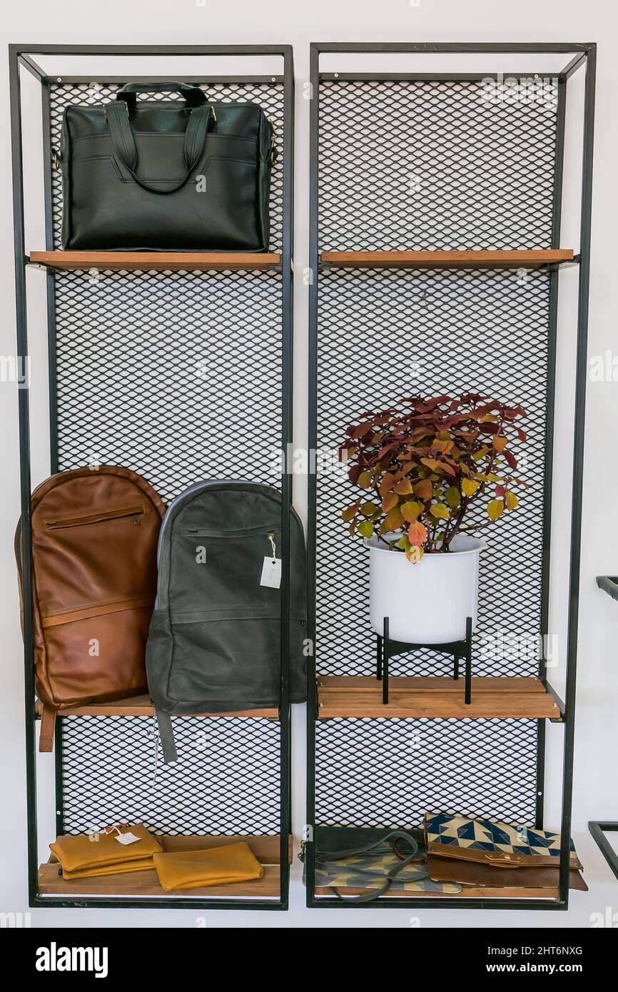 Vertical of bags on display at exhibitor stand at hand-made design fair ...