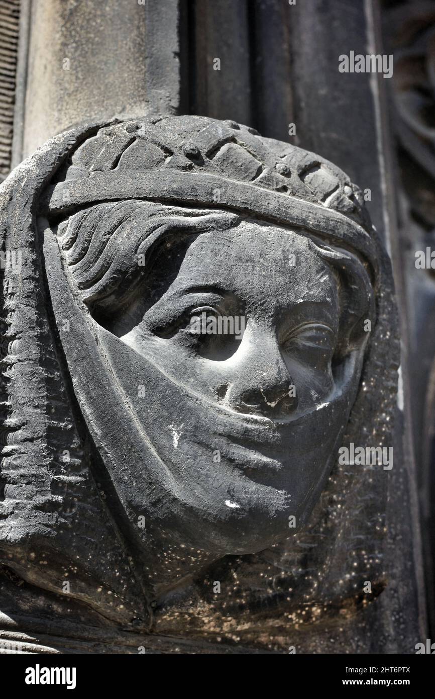 Majestic medieval stone face of a young woman with a strong Gothic ...
