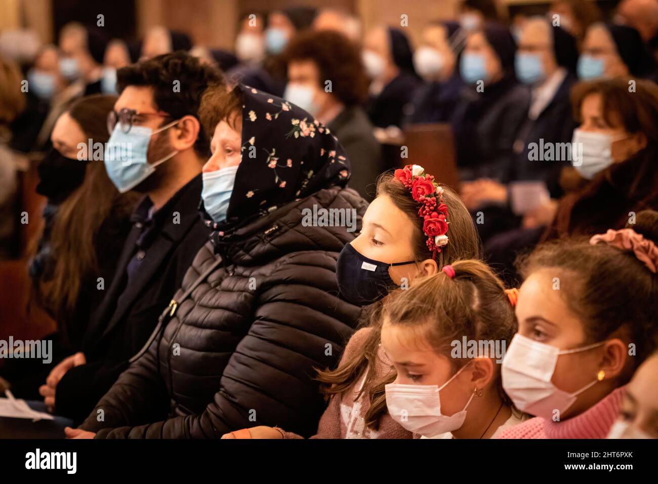 A girl seen wearing a traditional Ukrainian headband during the vigil ...