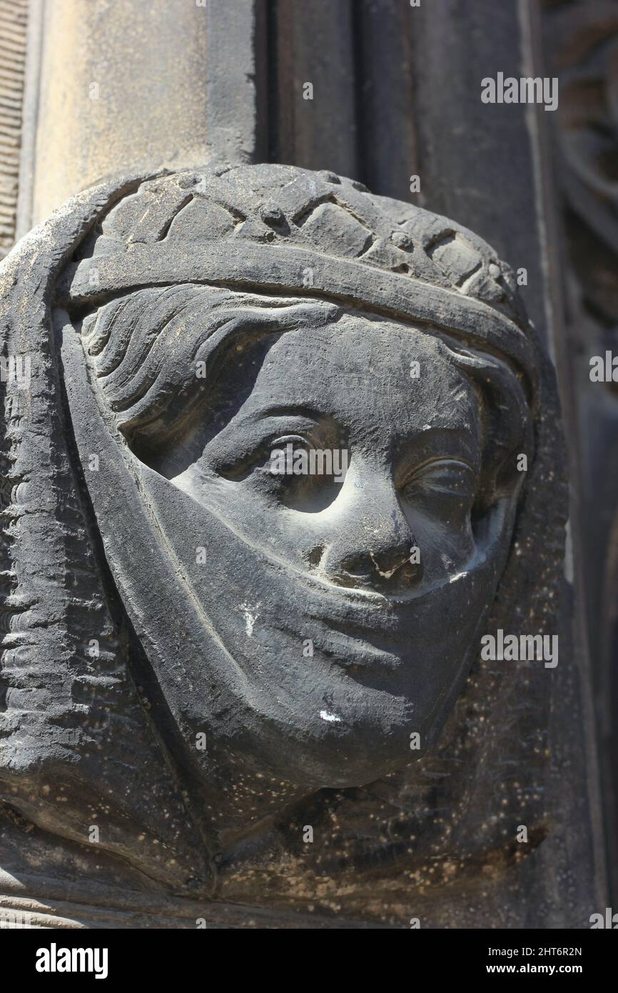 Majestic medieval stone face of a young woman with a strong Gothic ...