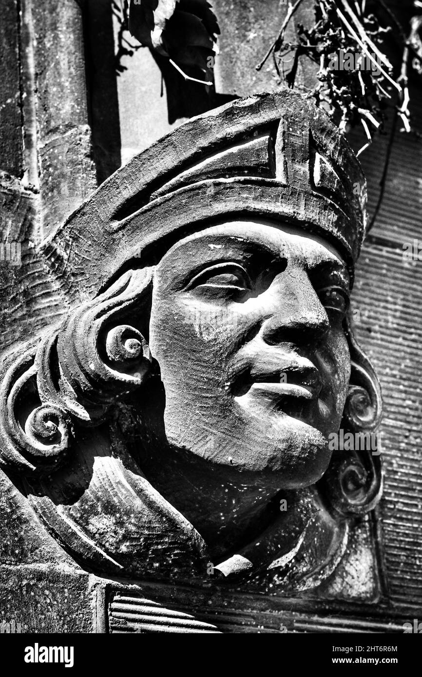 Majestic medieval stone face of a young man with a strong Gothic ...