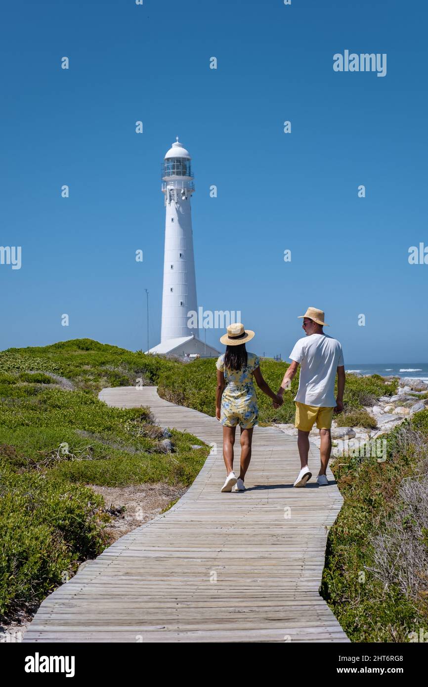 Couple man and women visiting the lighthouse of Slangkop Kommetjie Cape ...