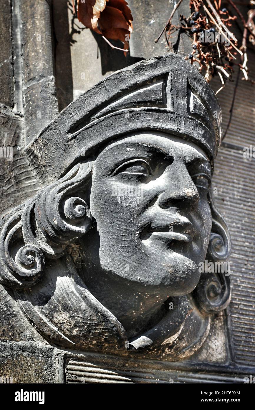 Majestic medieval stone face of a young man with a strong Gothic ...