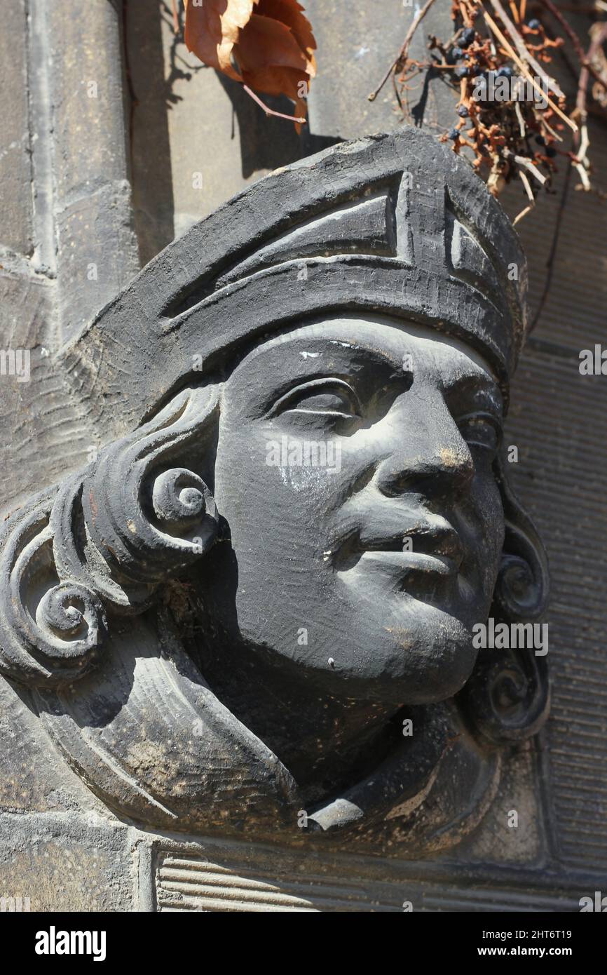Majestic medieval stone face of a young man with a strong Gothic ...