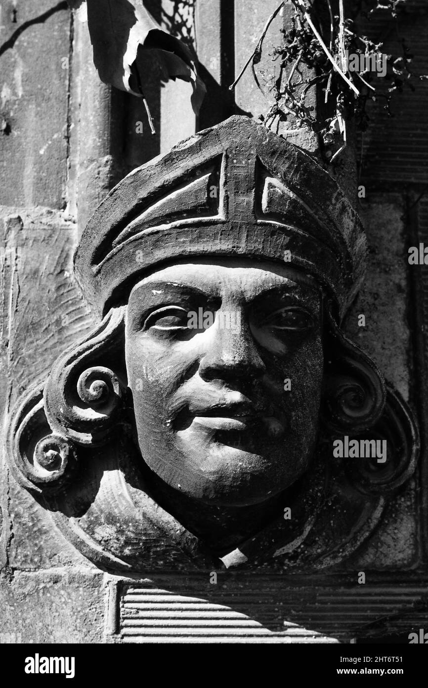 Majestic medieval stone face of a young man with a strong Gothic ...