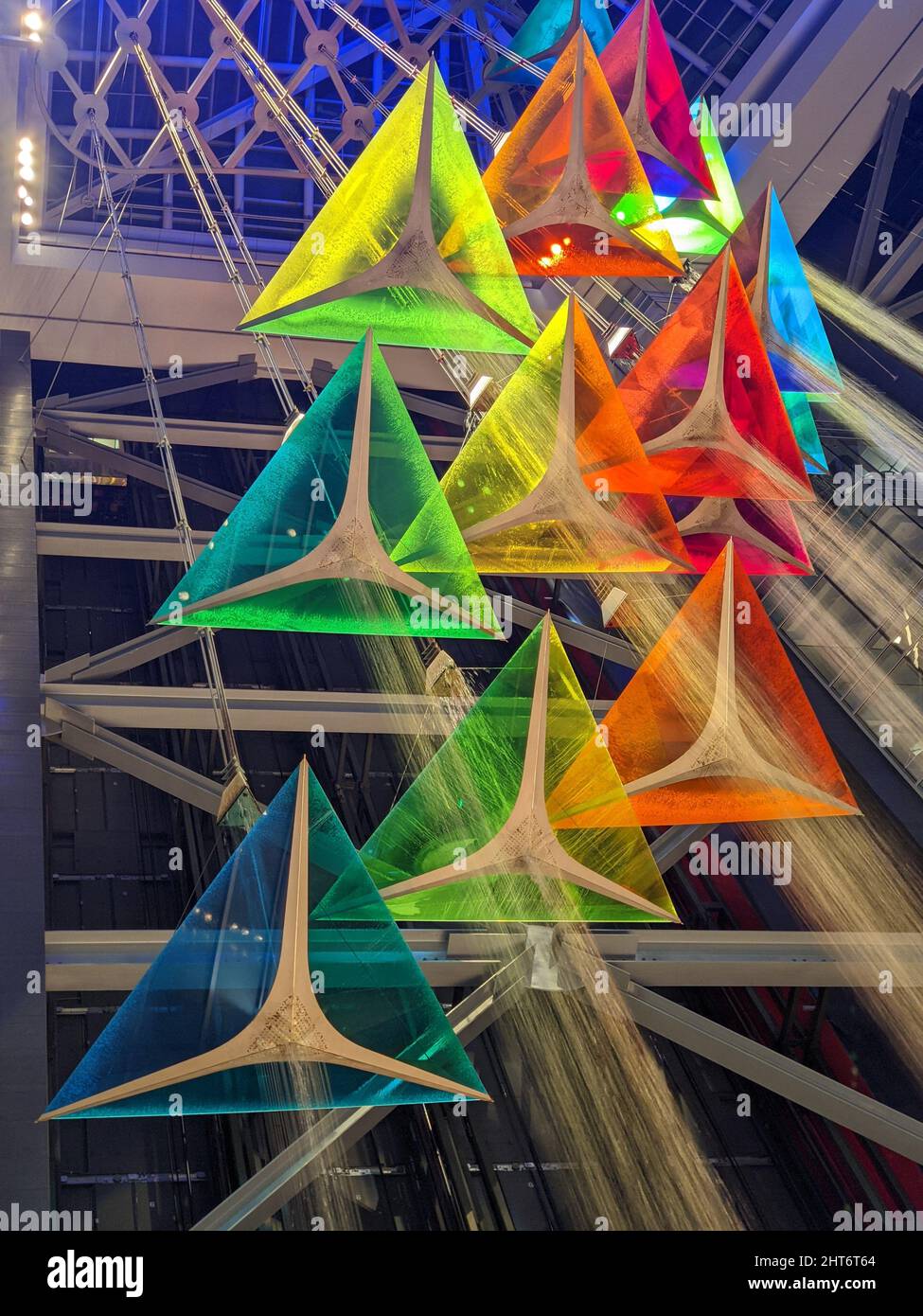 Vertical shot of the colorful triangles hanging from the ceiling ...