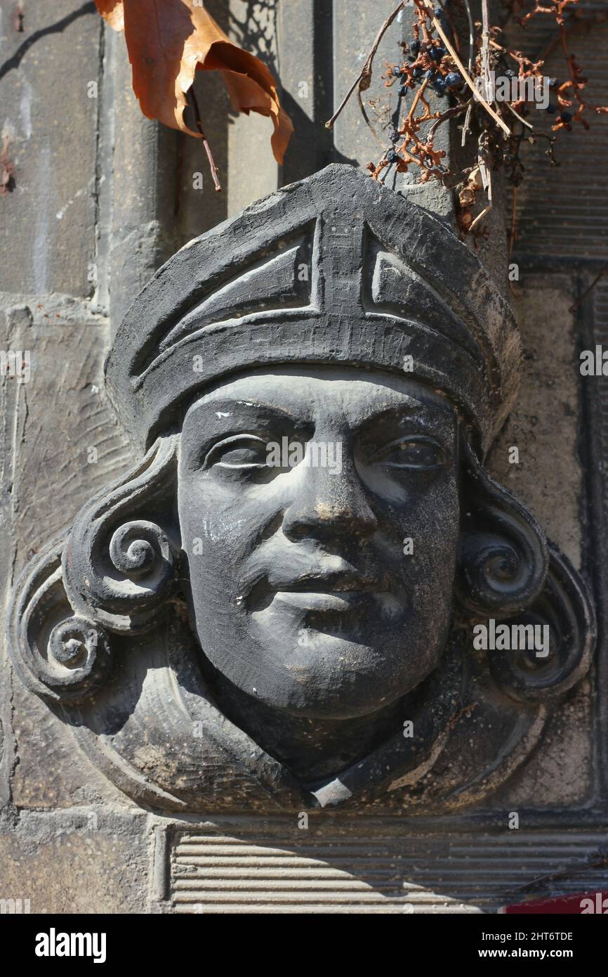 Majestic medieval stone face of a young man with a strong Gothic ...