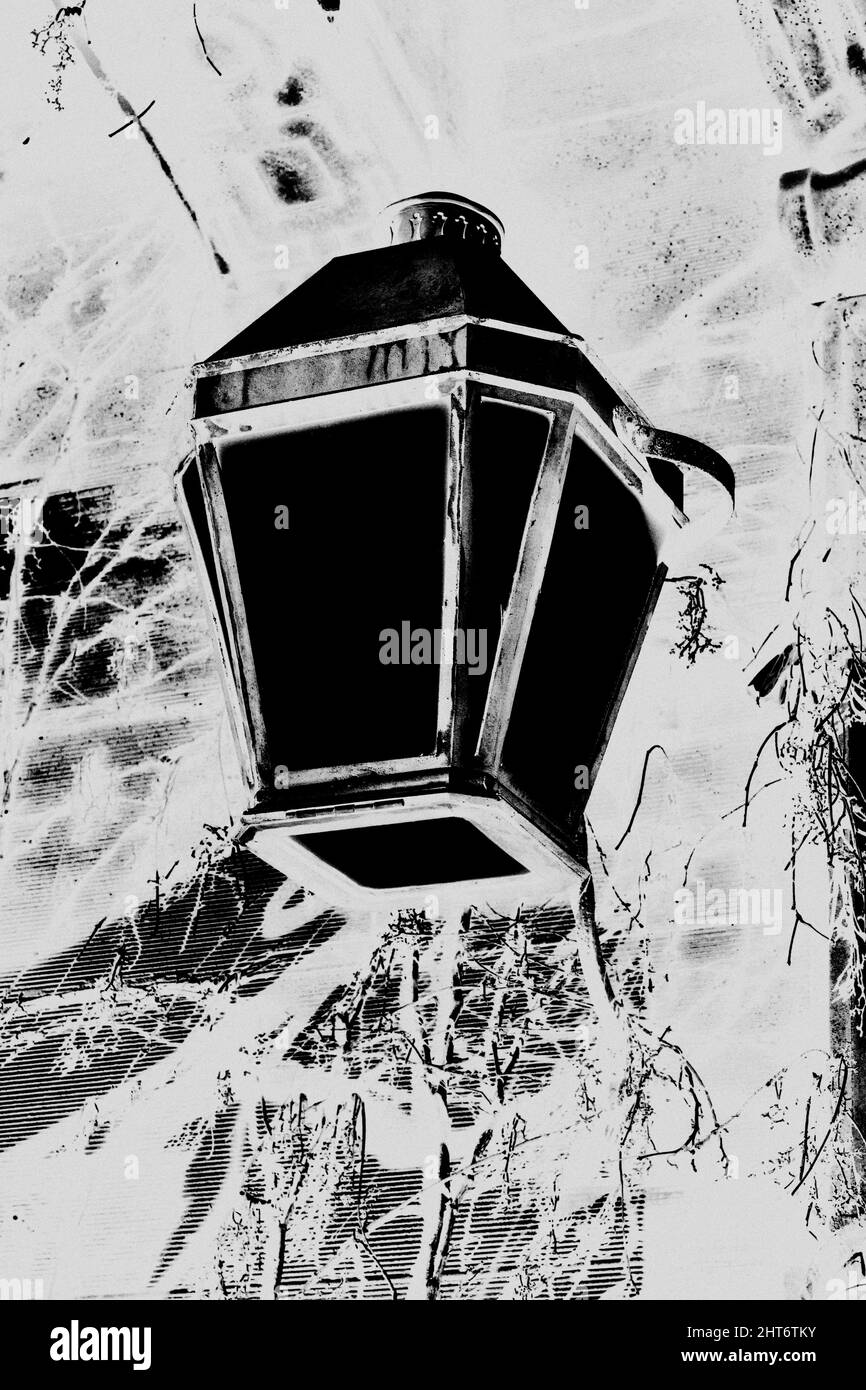 An antique vintage lantern lamp hanging from the ceiling in high ...