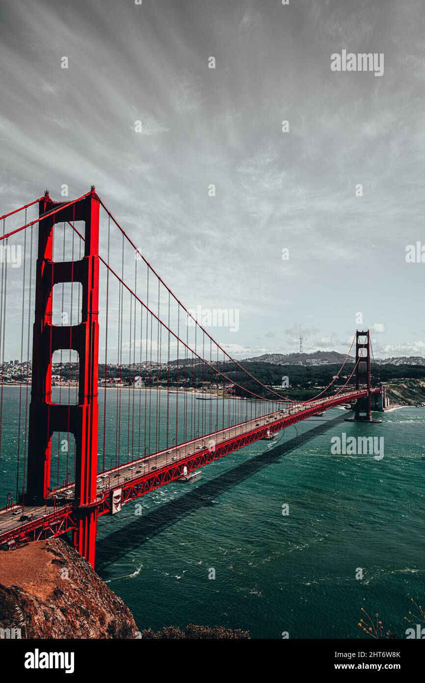 Famous Golden Gate Bridge in San Francisco under a gray cloudy sky ...