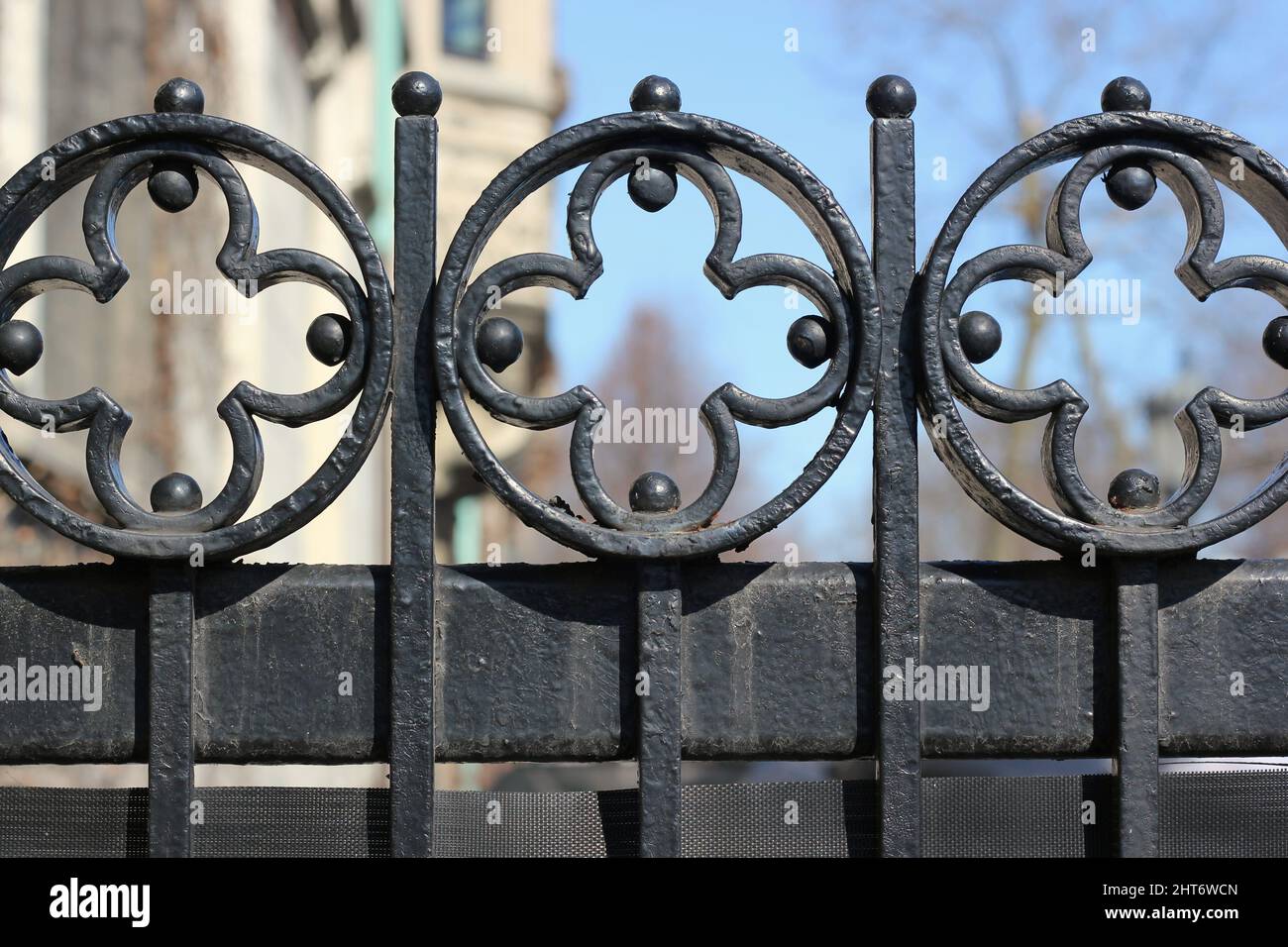 The cornice of a cast iron gate with a rhythmic pattern of crosses ...