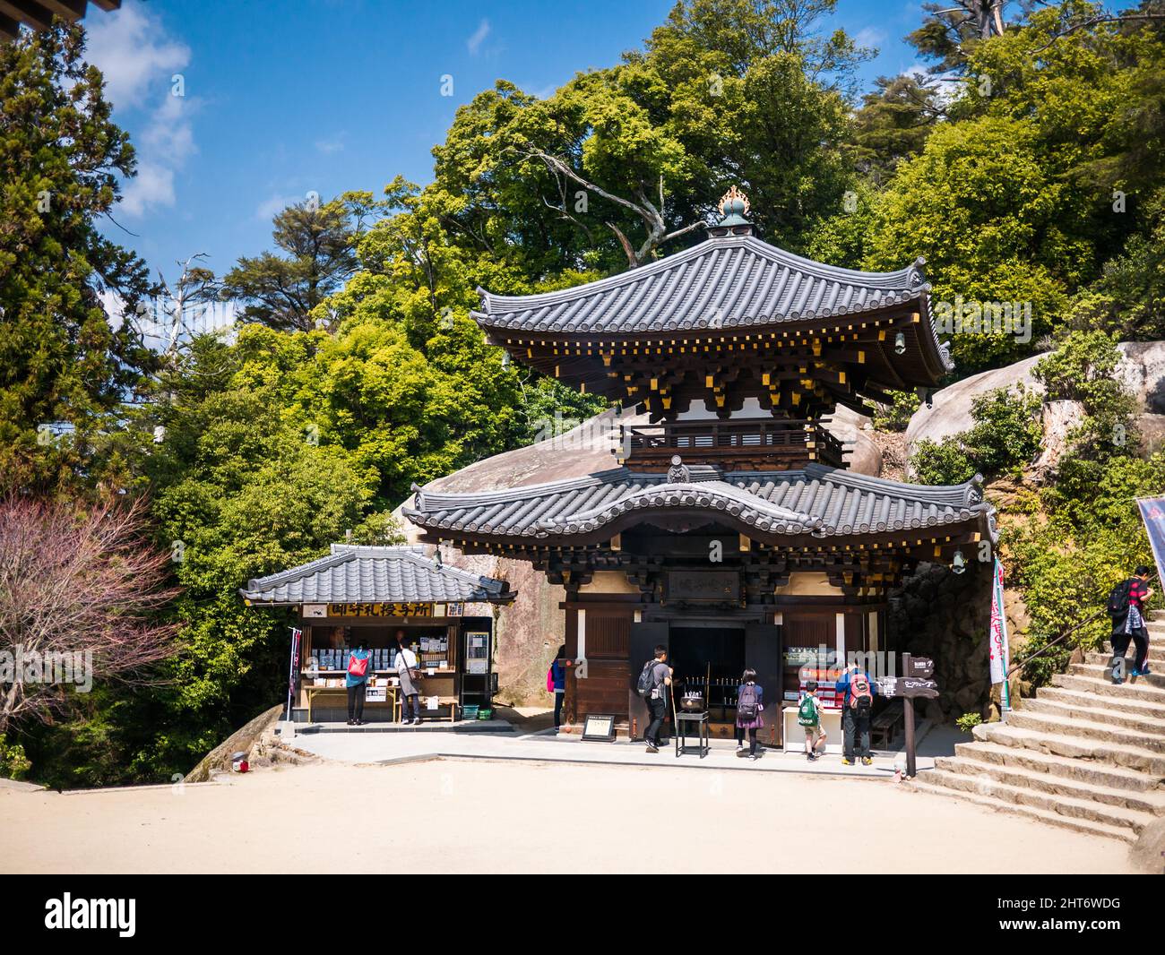 Facade of a temple against forest trees in Mt Misen, Miyajima, Japan ...