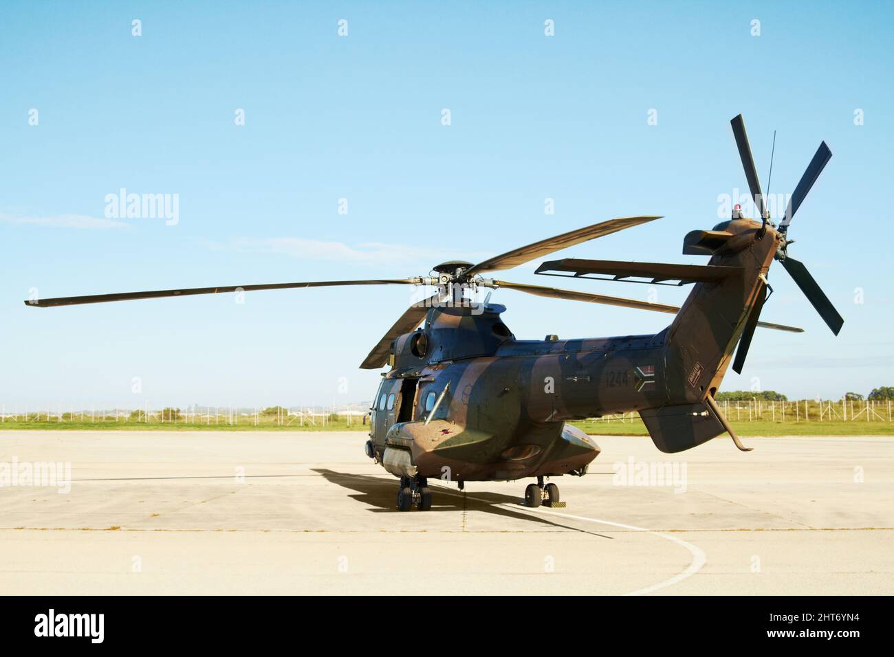 Ready for take-off. A military helicopter standing on a launchpad Stock ...