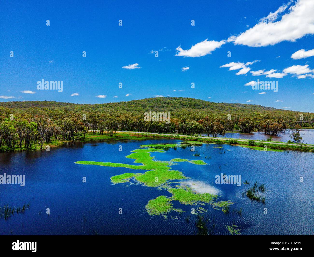 Beautiful aerial view of Emmaville with a small lake under a cloudy sky ...
