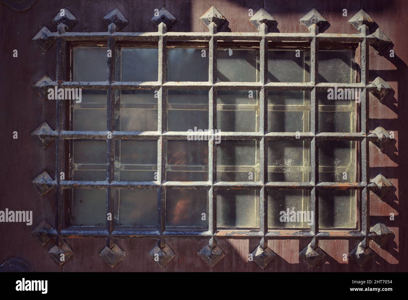 The medieval metal grating on a secure wooden door Stock Photo - Alamy