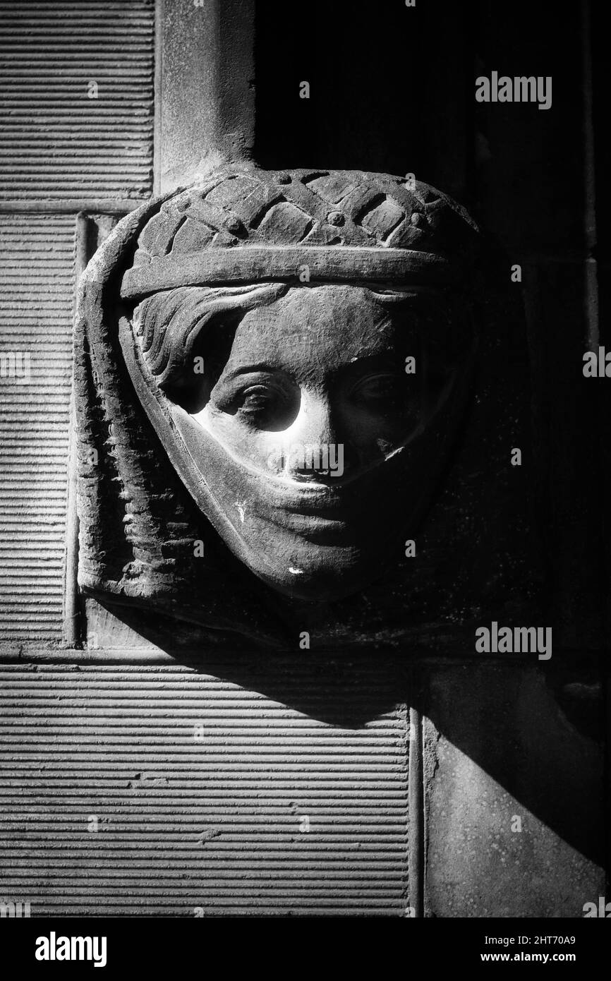 Majestic medieval stone face of a young woman with a strong Gothic ...