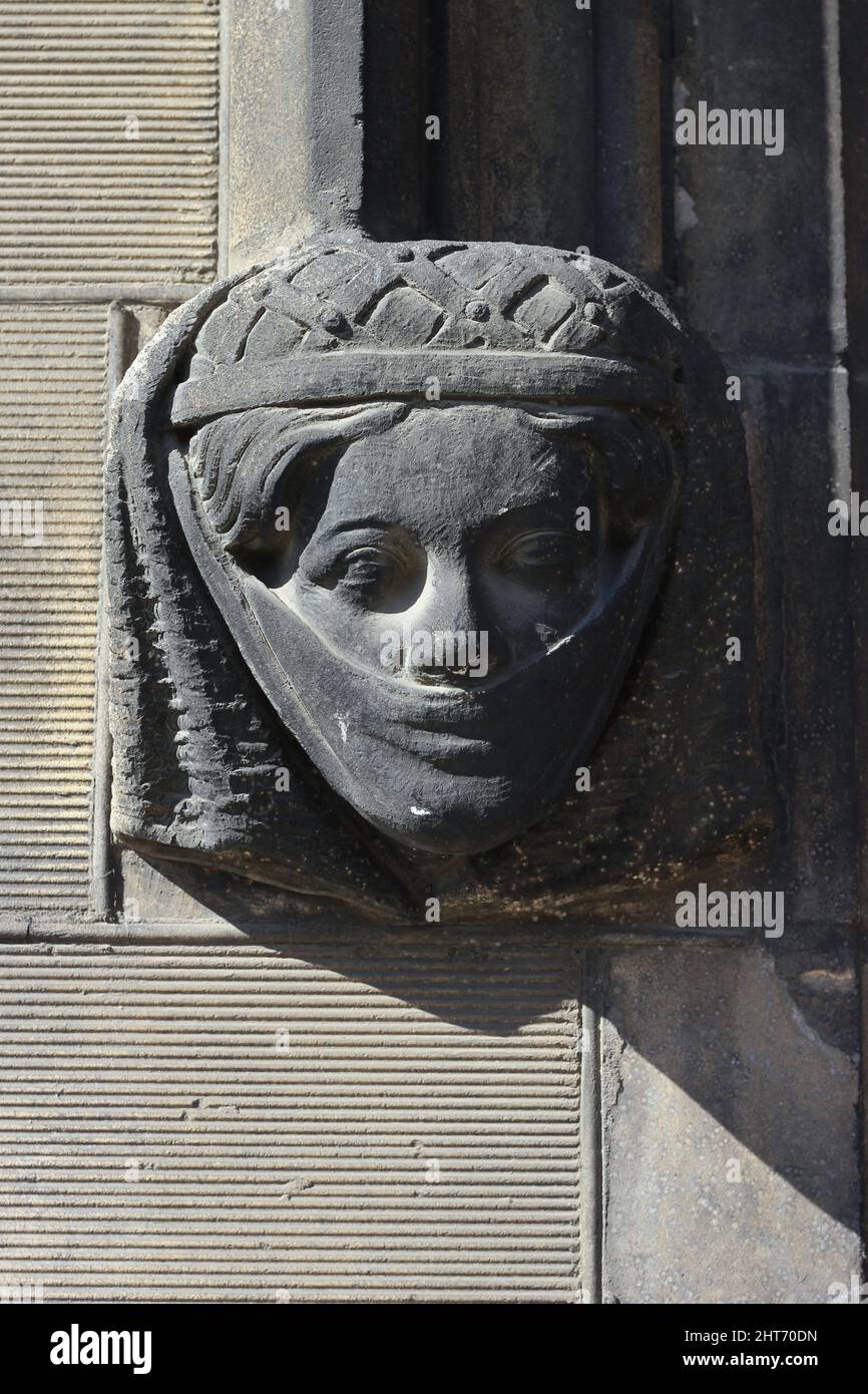 Majestic medieval stone face of a young woman with a strong Gothic ...