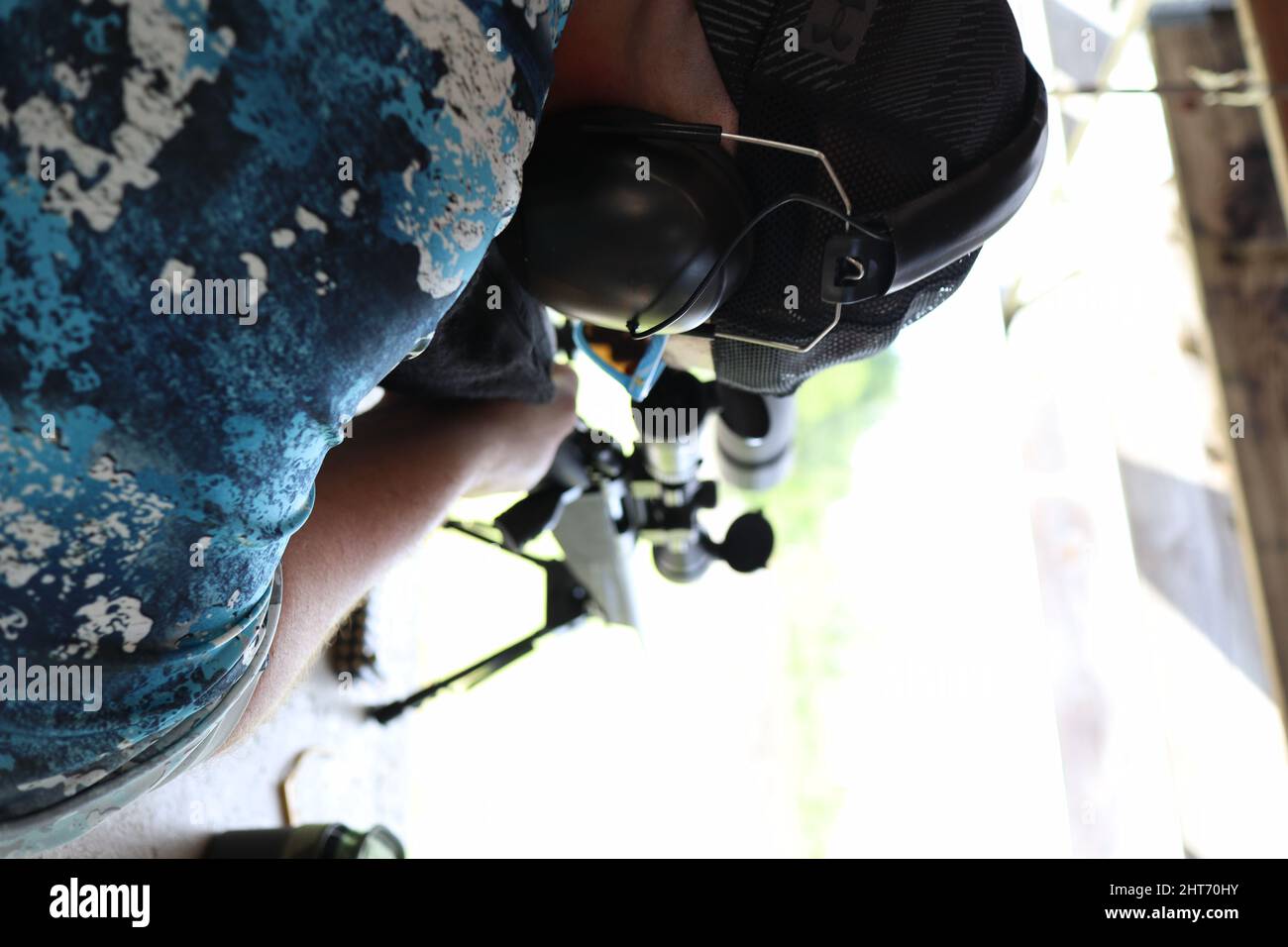 Vertical shot of a shooter with sniper rifle Stock Photo - Alamy