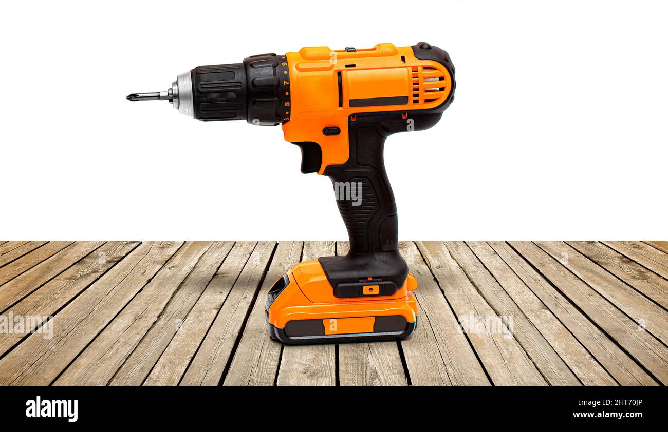 Orange electric cordless screwdriver drill isolated on white background ...