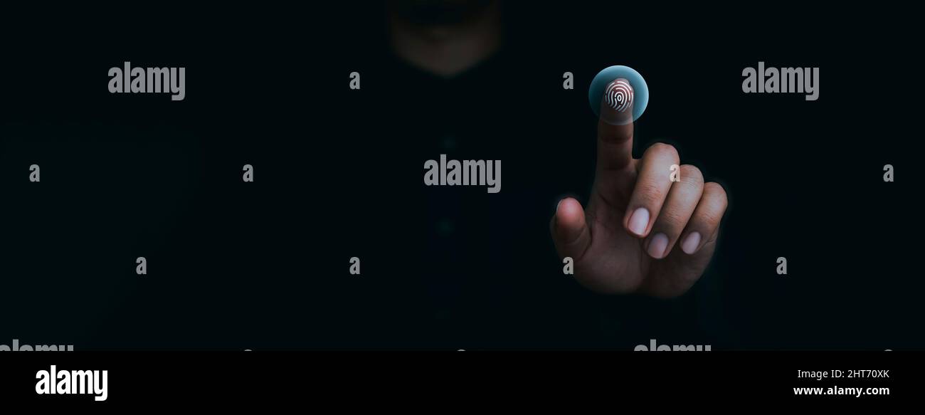 Blue fingerprint scan icon on virtual screen while finger scanning for ...