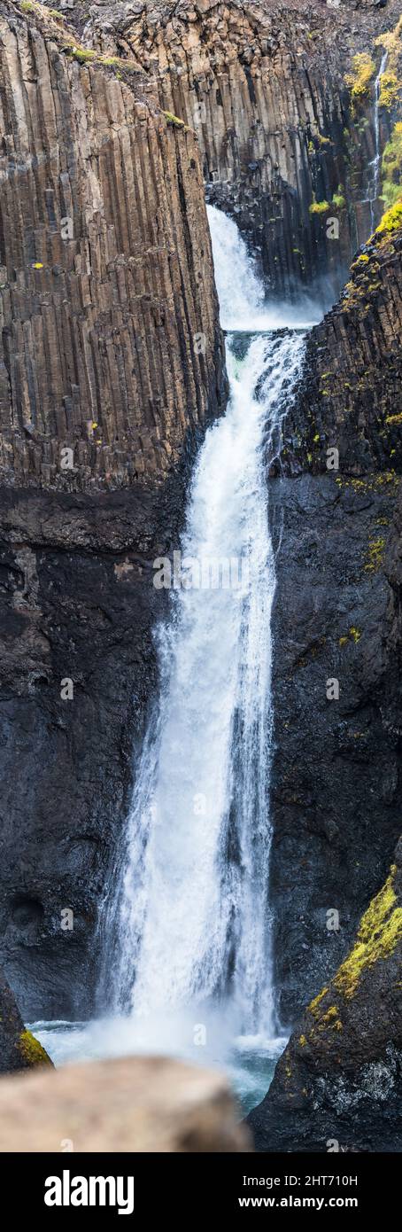 Spectacular waterfall between basaltic columns Stock Photo - Alamy