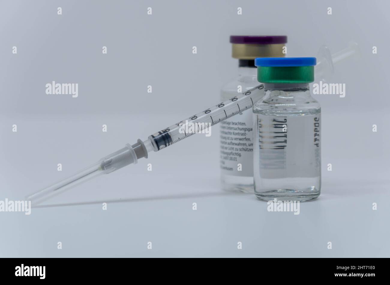 Closeup of a Syringe and Sterile Vial Filled with Medication Solution ...