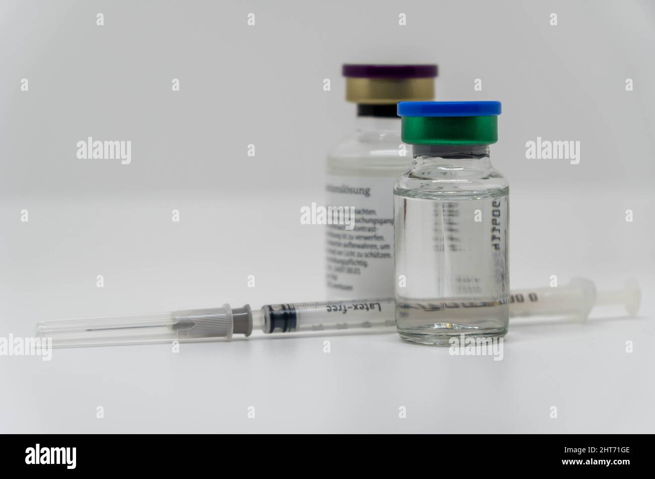 Closeup of a Syringe and Sterile Vial Filled with Medication Solution ...