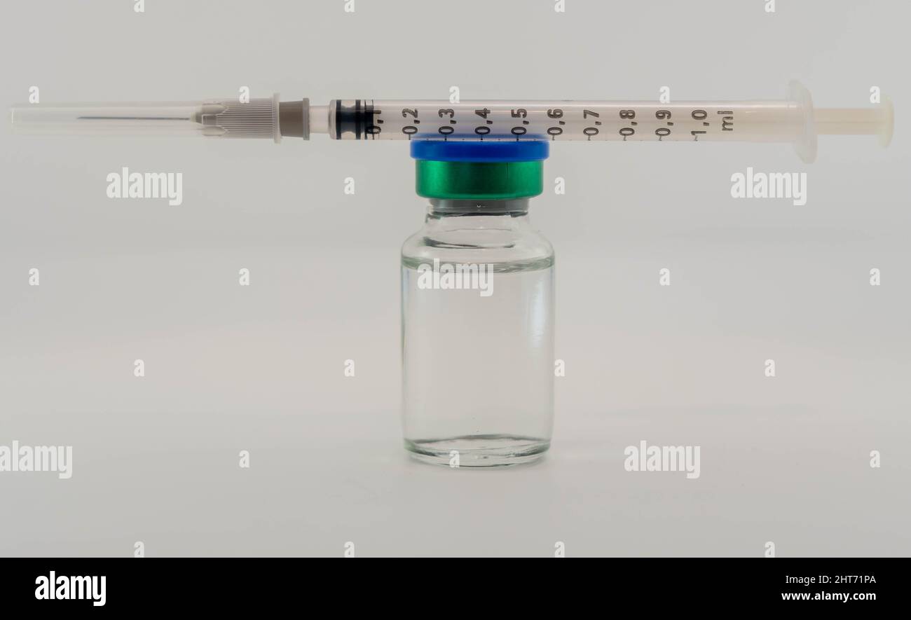 Closeup of a Syringe and Sterile Vial Filled with Medication Solution ...