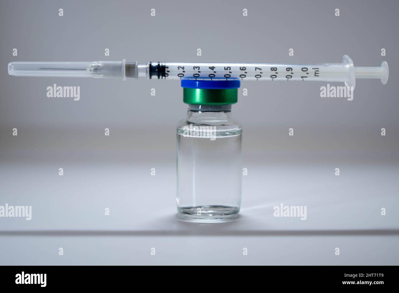 Closeup of a Syringe and Sterile Vial Filled with Medication Solution ...